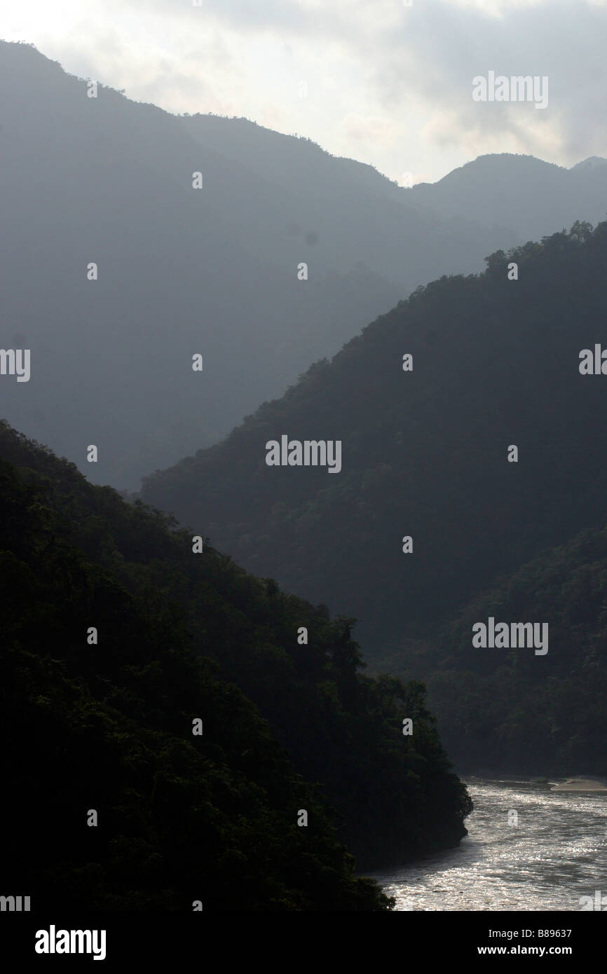A view over the holy river of Ganges and a mountain range near ...