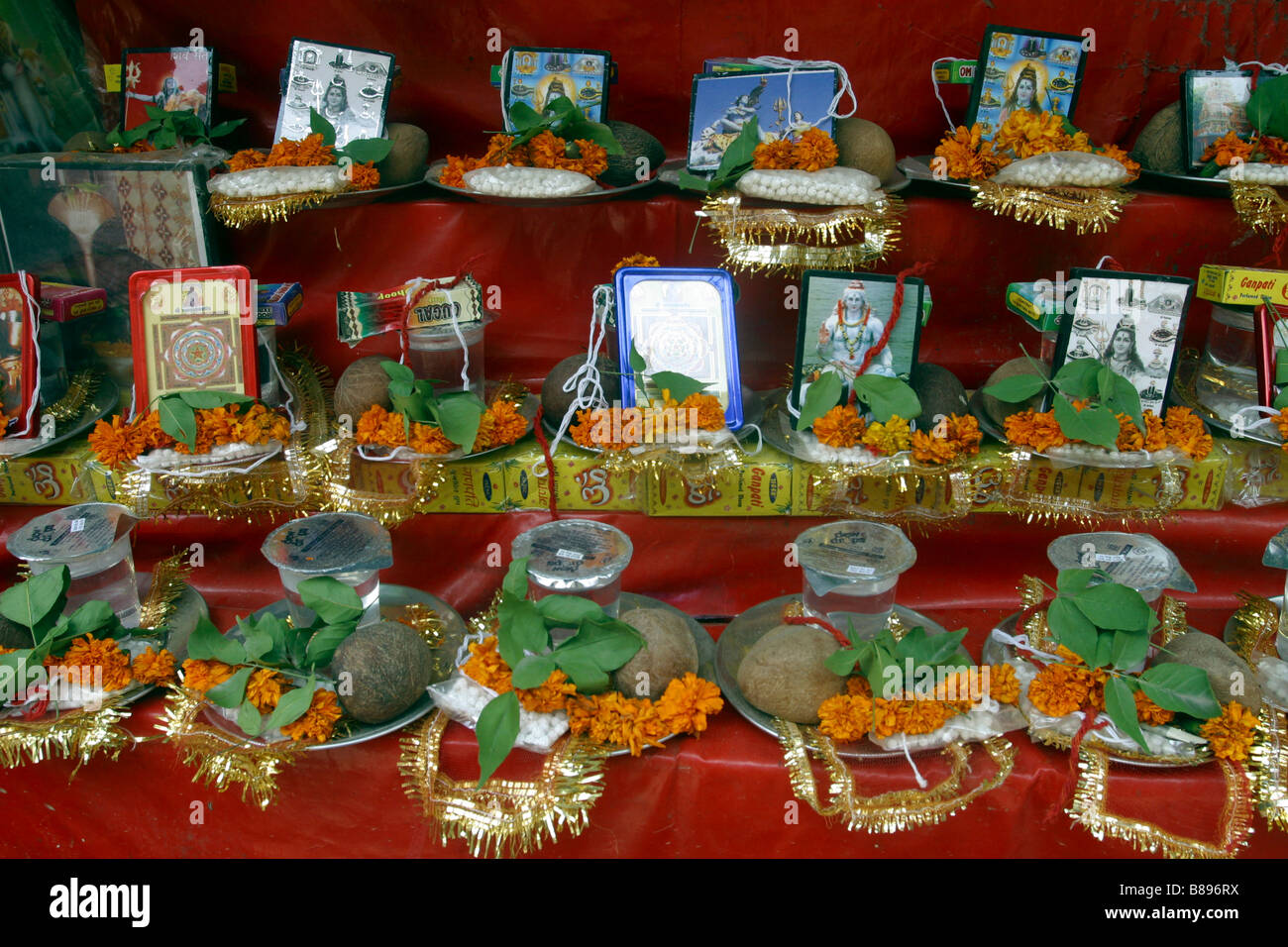 Temple offerings are lined upp for sale at a stall outside a temple in ...