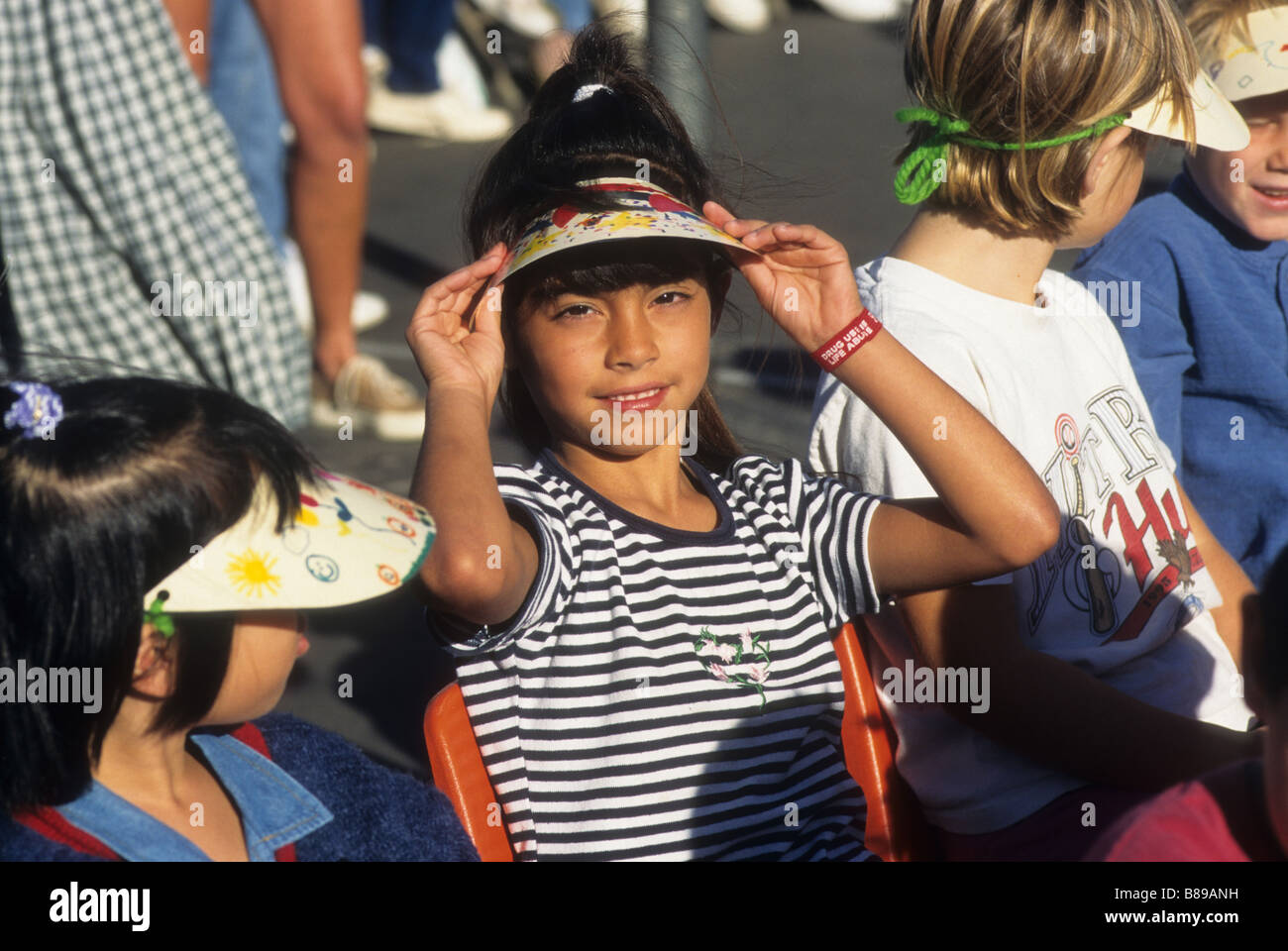 Hispanic girl with visor in afternoon sun health sunburn skin Stock ...