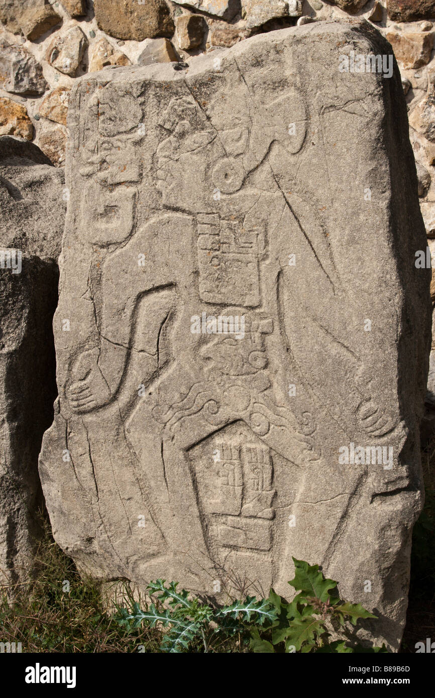 Ancient zapotec relief of dancing man on the wall in Monte Alban Mexico ...