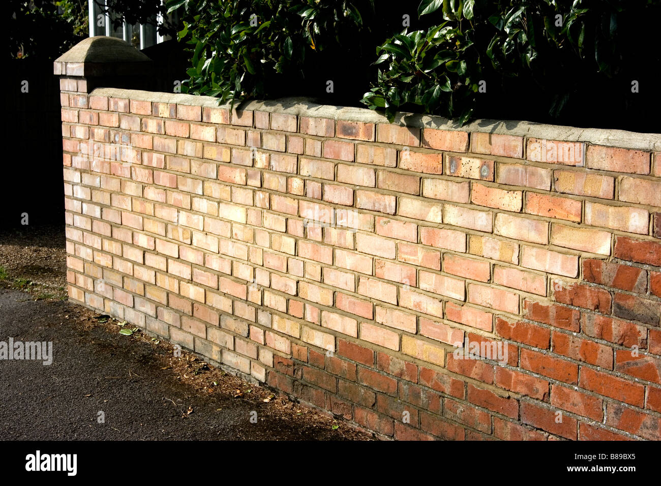 New section of brick wall joining with original brickwork Stock Photo ...
