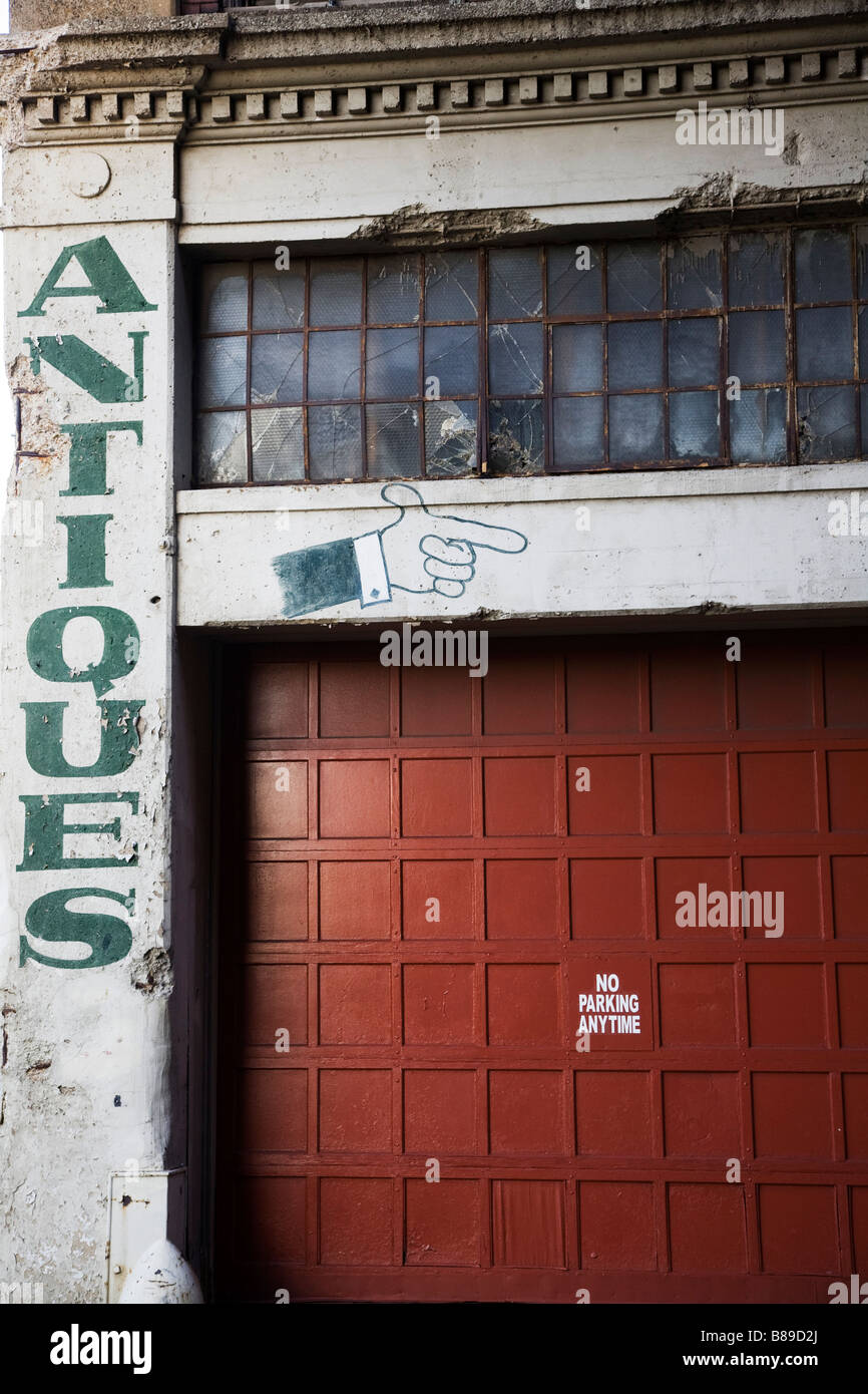 Antiques sign on old warehouse building in The Strip District ...
