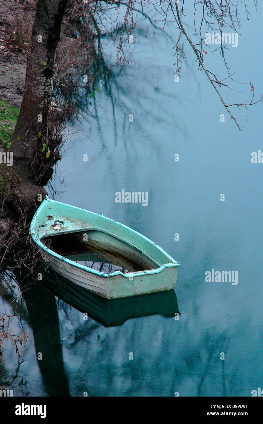 Sink boat floating river bank melancholy reflex water light blue ...