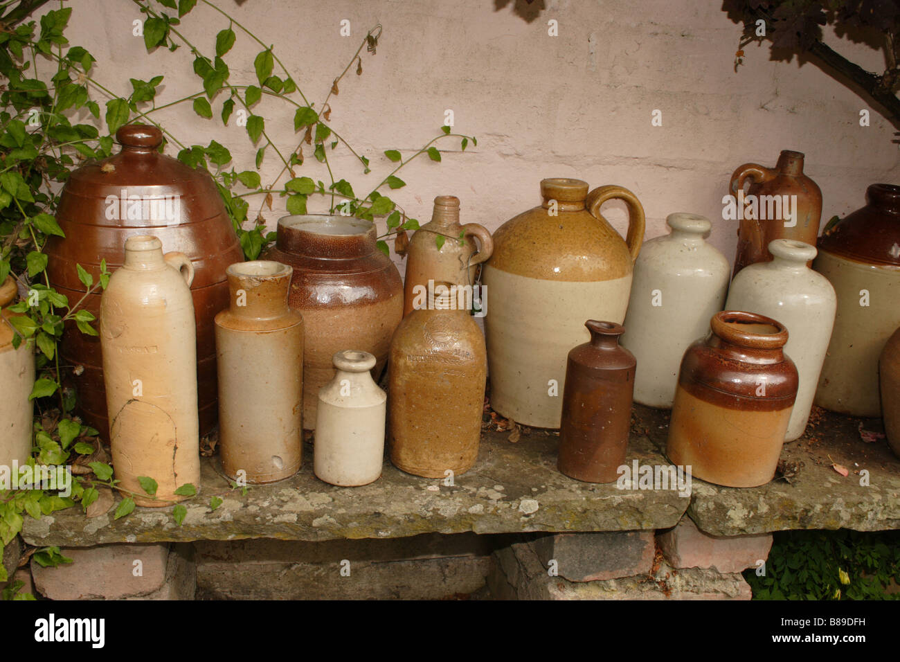 Collection of old brown jugs, bottles and pots Stock Photo - Alamy