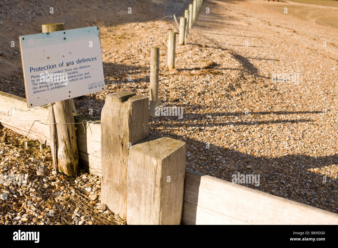 sign indicating protection of sea defences on a beach Stock Photo - Alamy