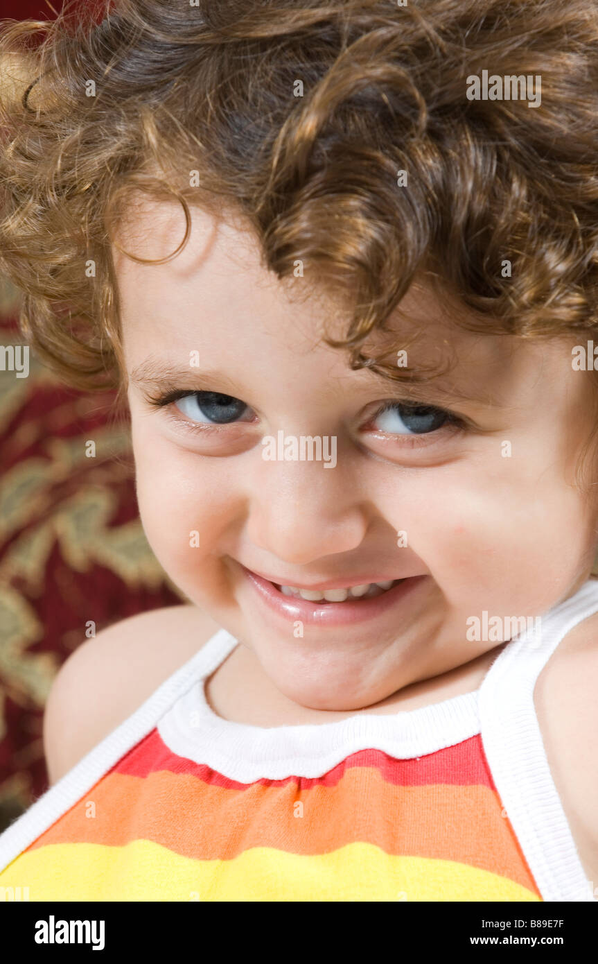 beautiful young girl looking at camera smiling Stock Photo - Alamy