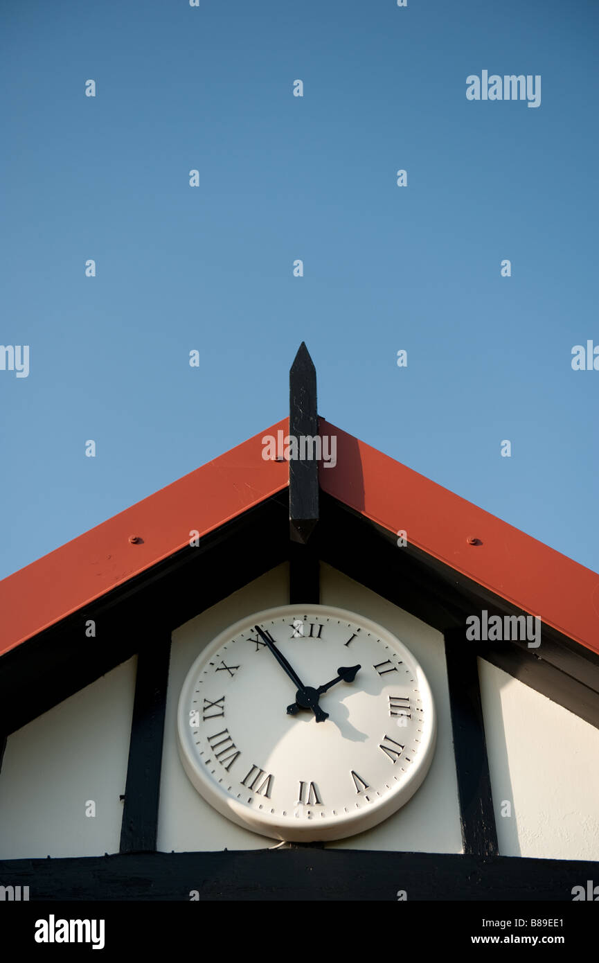 Clock on sports pavilion exterior set at five minutes to two 1 55pm ...