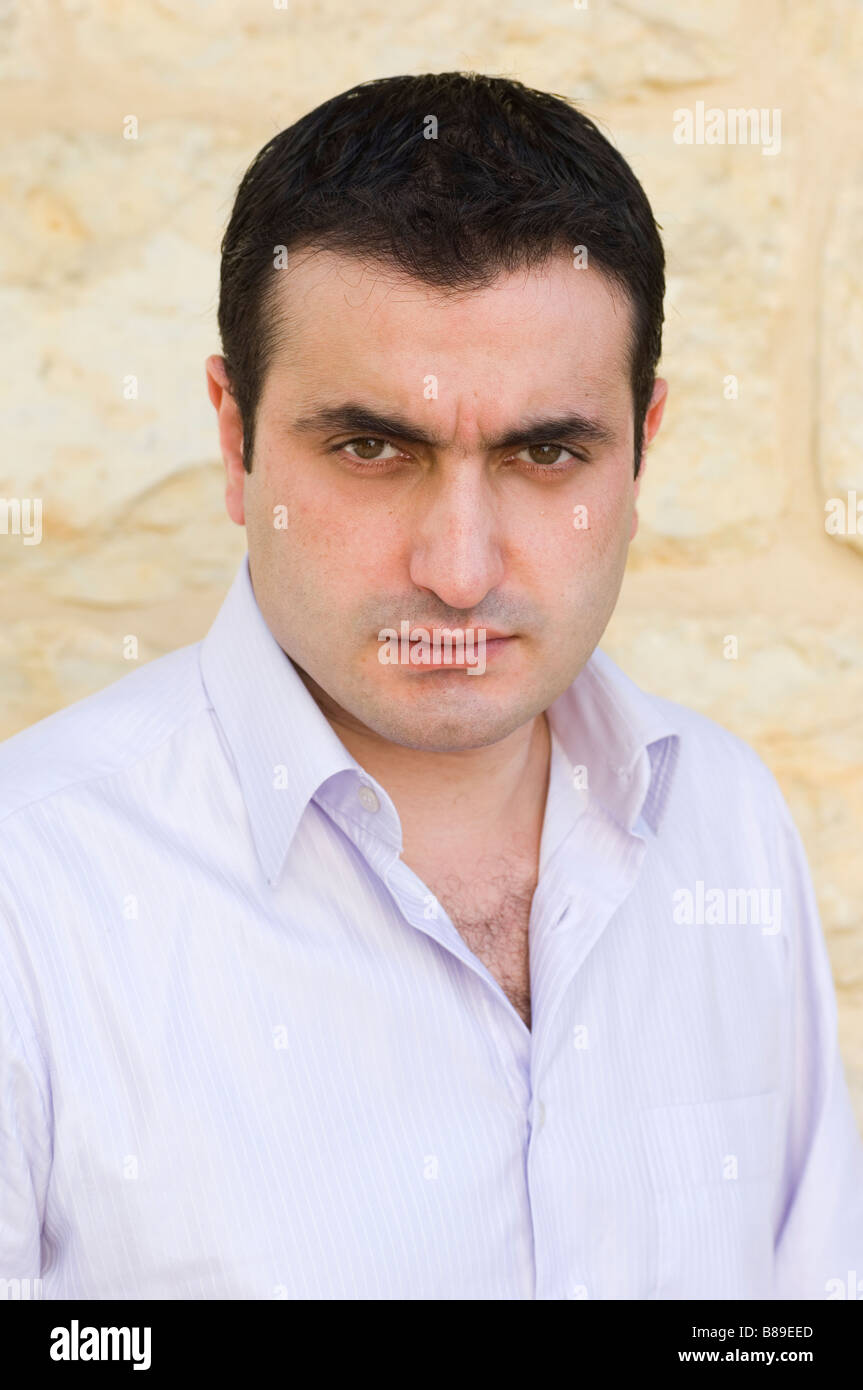 Portrait of a serious Middle Eastern man looking at camera Stock Photo ...