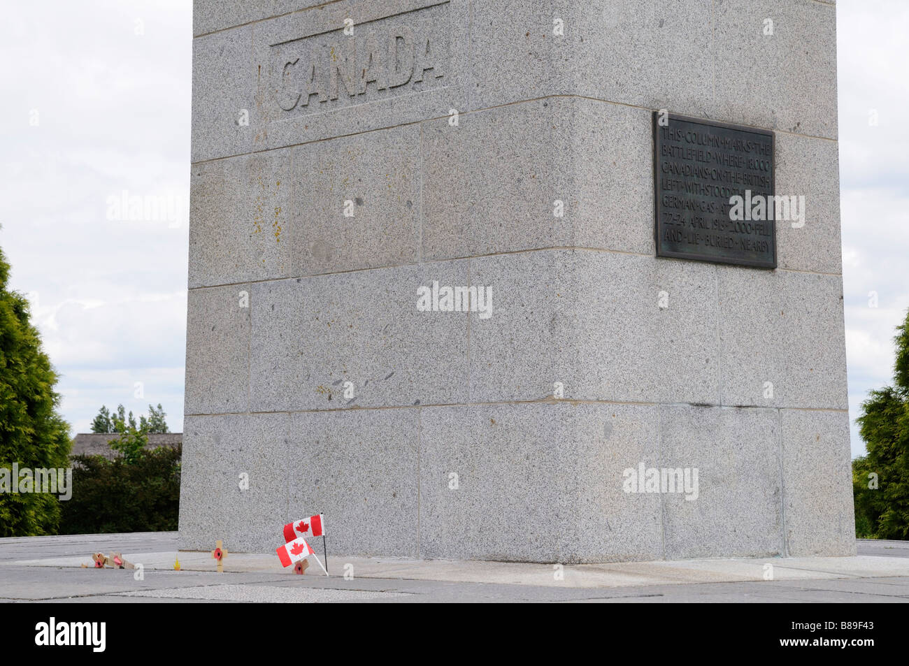 Canadian flags and remembrance crosses at the foot of the "Brooding ...