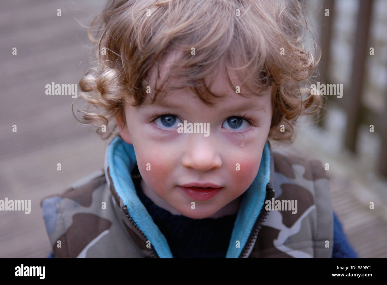 Boy looking happy Stock Photo - Alamy