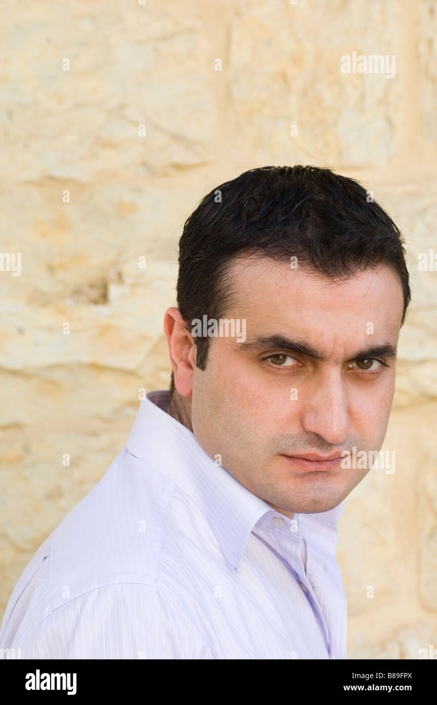 Serious man looking at camera Stock Photo - Alamy