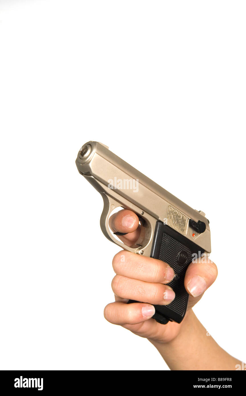 Woman's hand holding a gun Stock Photo - Alamy