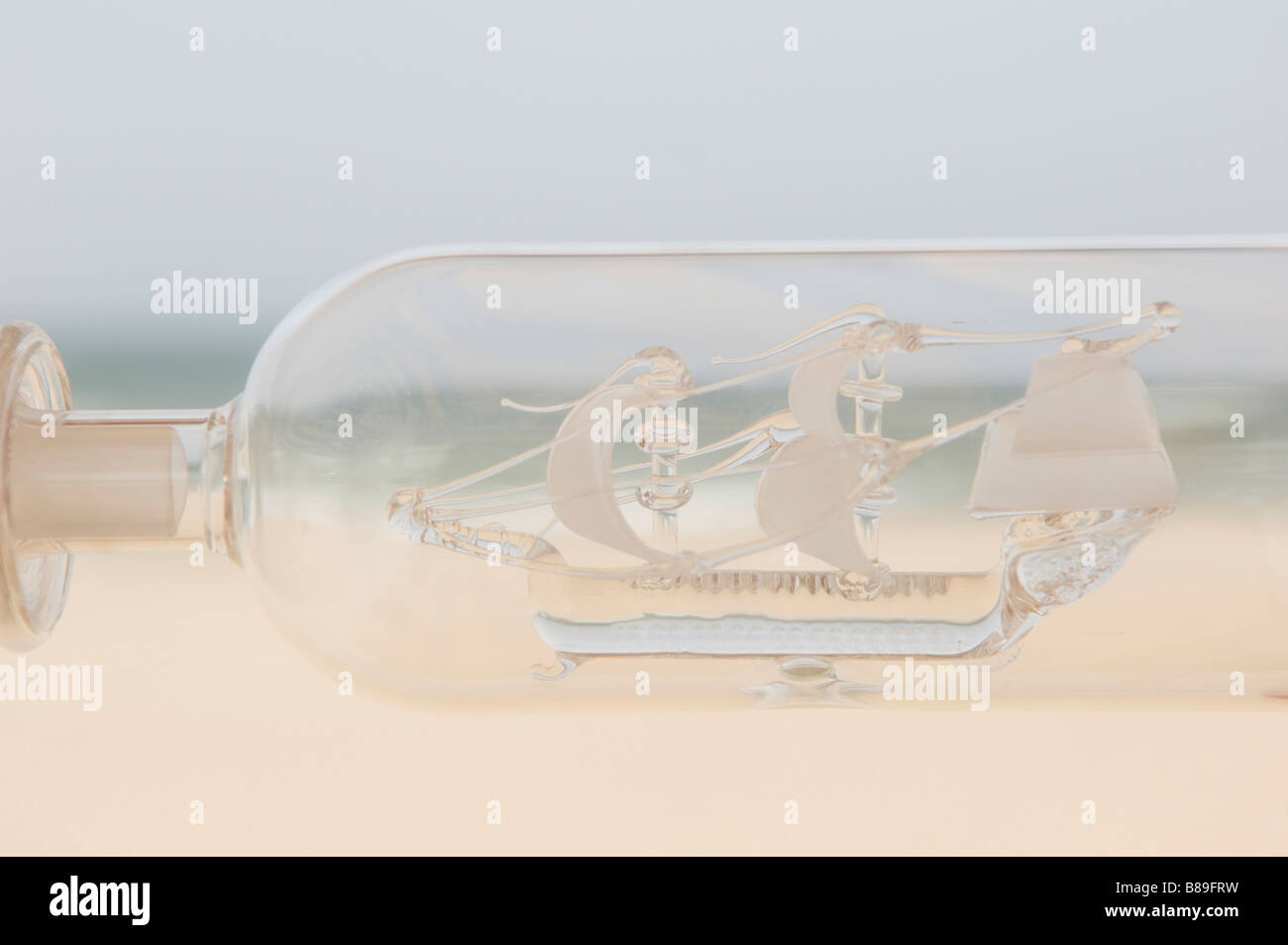Glass sailing ship model in a bottle by the sea Stock Photo - Alamy