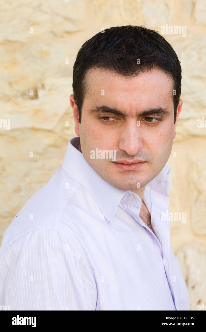 Man looking over shoulder Stock Photo - Alamy