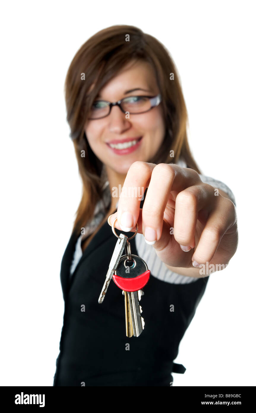 Smiling developer gives keys to new home Isolated on white background ...