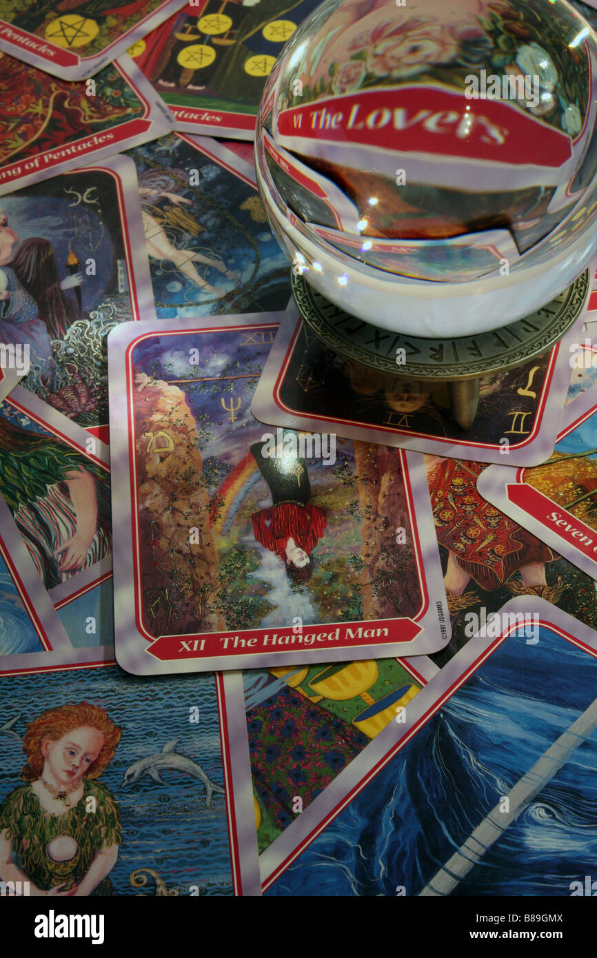 A photograph of a mystical crystal ball and the tarot card The Lovers ...