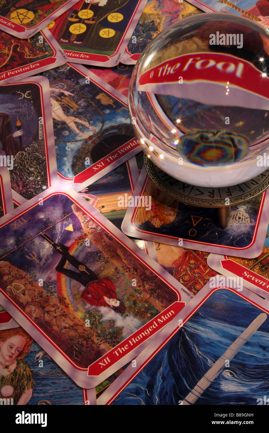 A photograph of a mystical crystal ball highlighting the tarot card The ...
