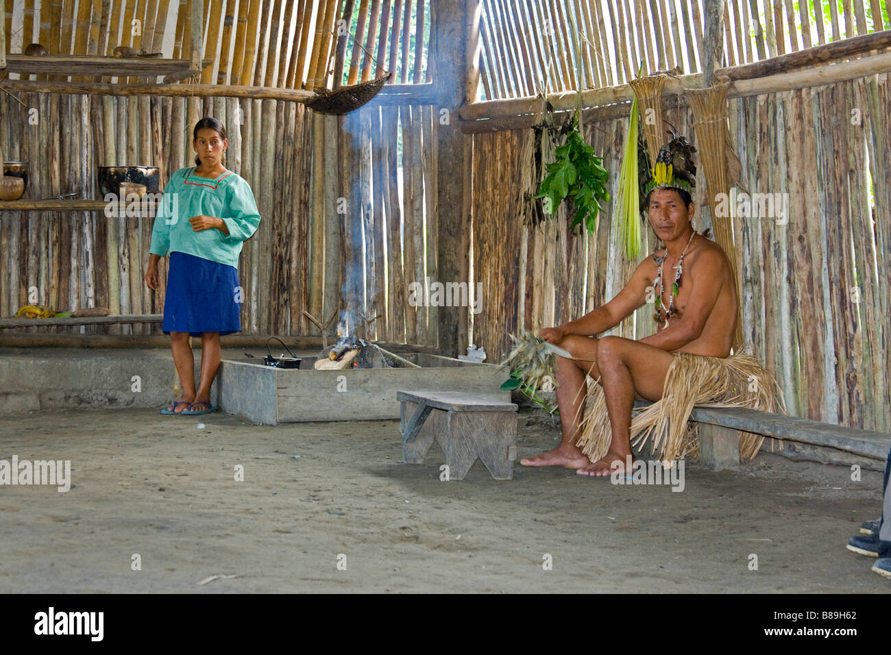 Indian woman and Shaman sorcerer sitting with grass skirt holding magic ...