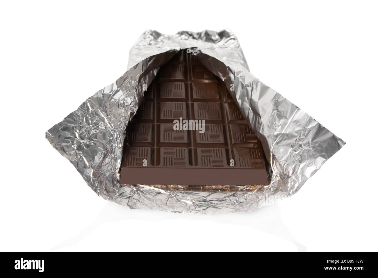 Dark chocolate bar inside wrapping foil isolated on white background ...
