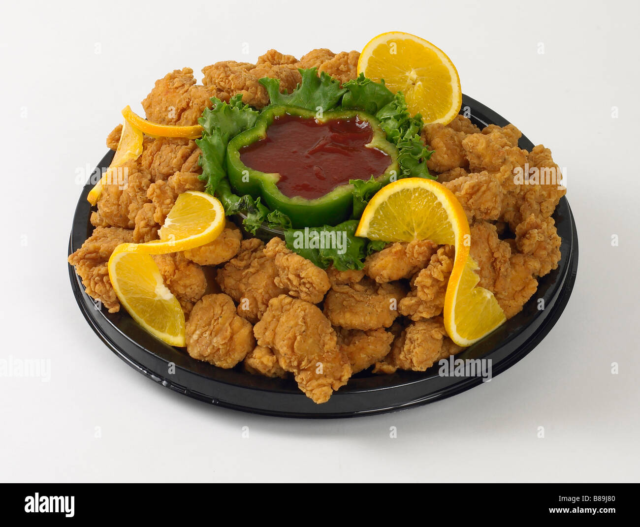fried chicken dipping deli style party tray Stock Photo - Alamy