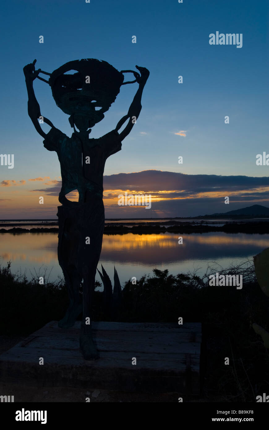 Statue of a saltworks worker at sunset, Ibiza, Spain Stock Photo - Alamy