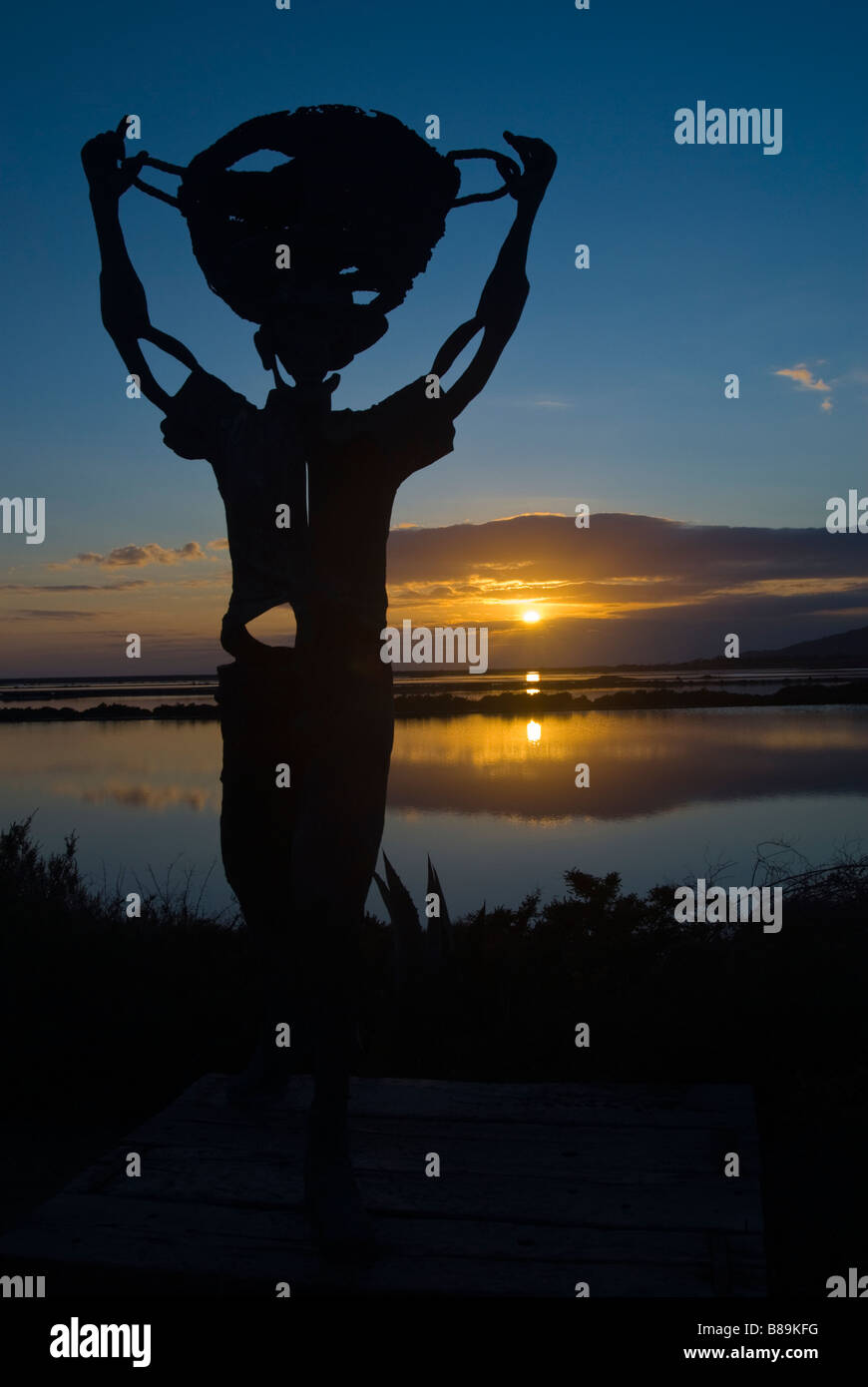 Statue of a saltworks worker at sunset, Ibiza, Spain Stock Photo - Alamy