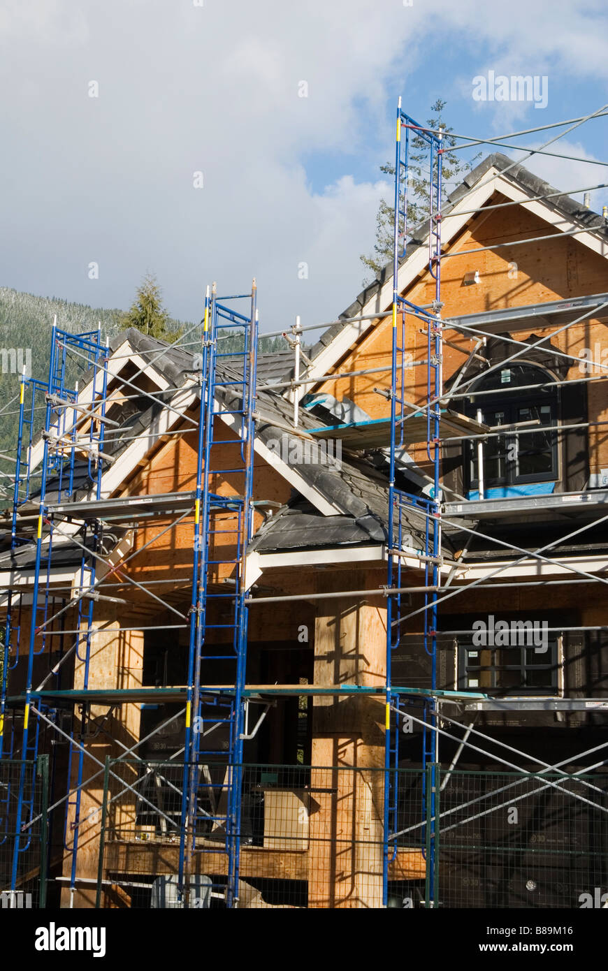 Scaffolding on a new home being built Stock Photo - Alamy