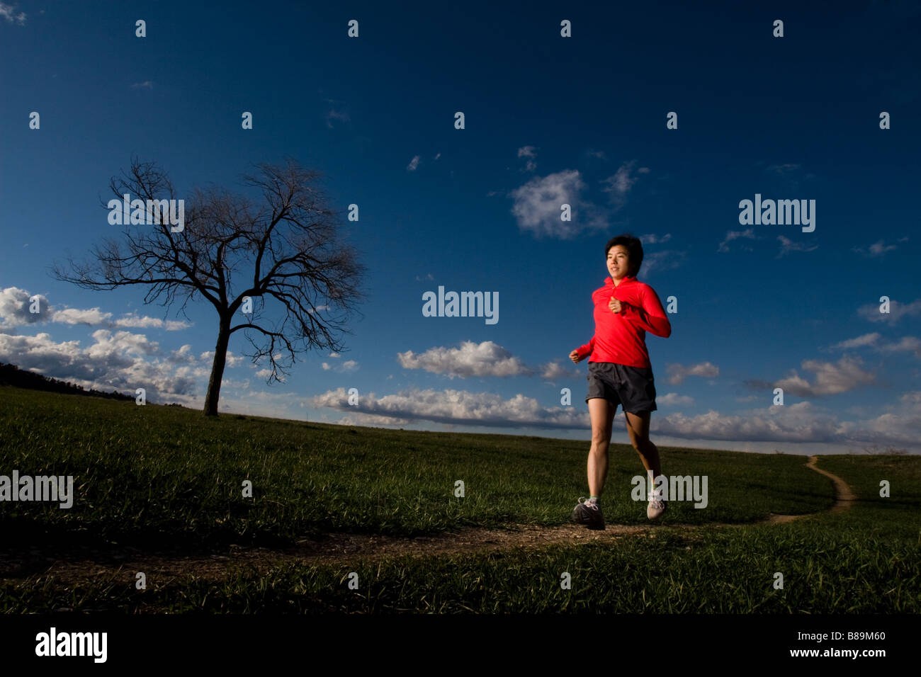 women trail running on Stadium Trail in Fort Collins Colorado in a red ...
