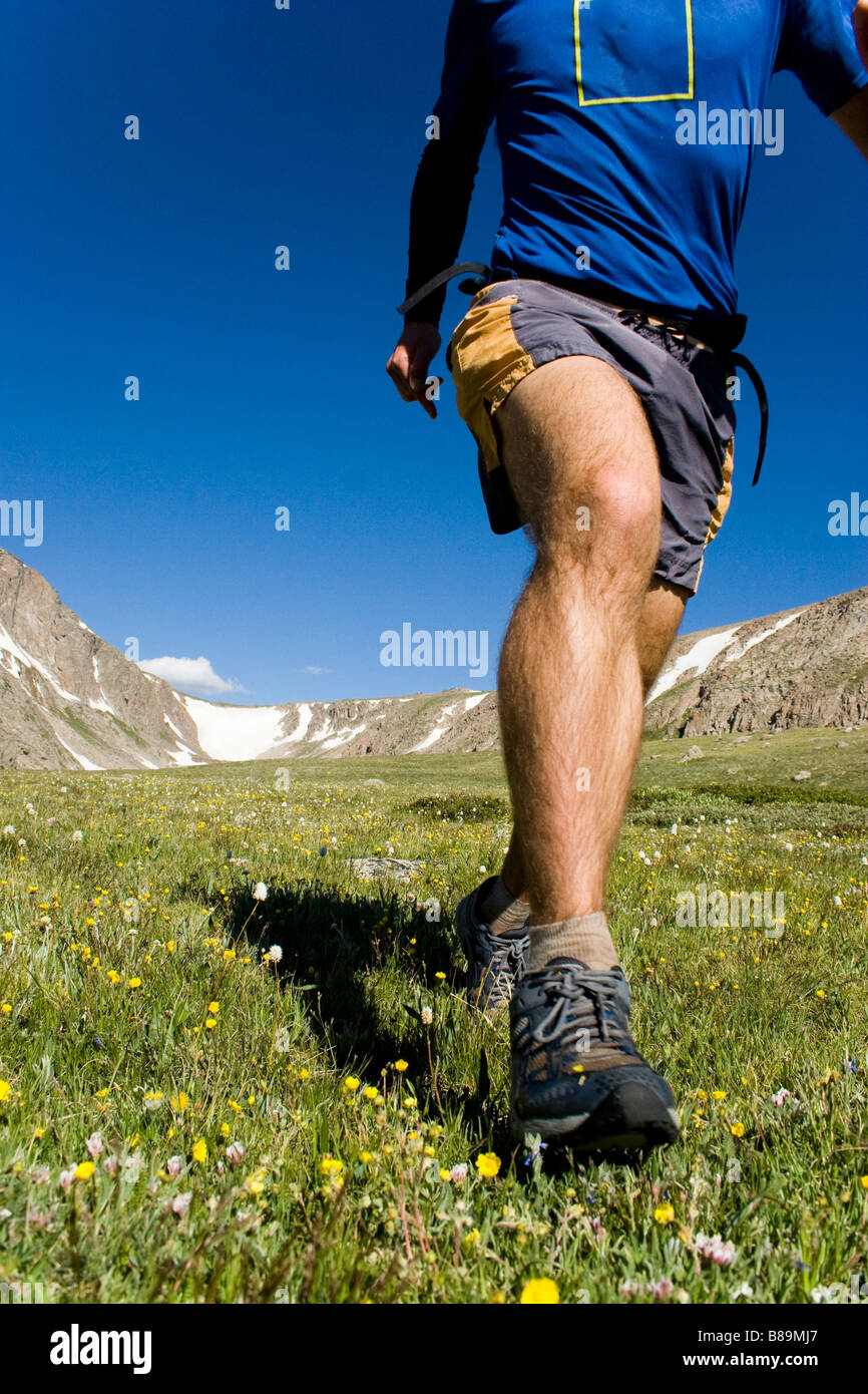 Man trail running in Rocky Mountain National Park in route to Lost and ...