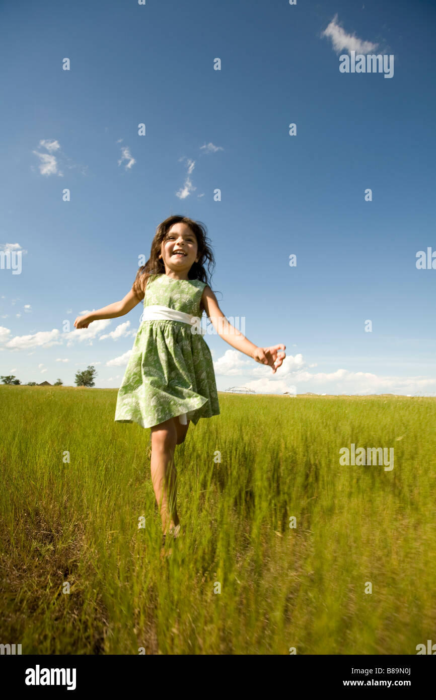 Girl running through tall grass hi-res stock photography and images - Alamy