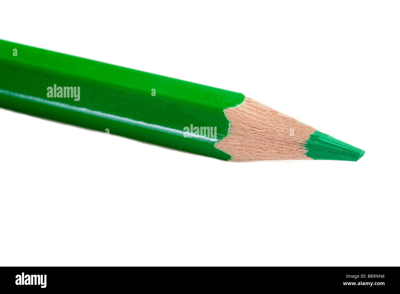 A green pencil expanded very sharp on a white background Stock Photo ...