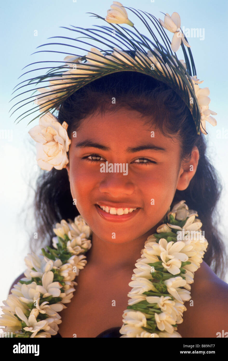 Polynesian girl with flower lei, headdress and beautiful smile on Cook ...