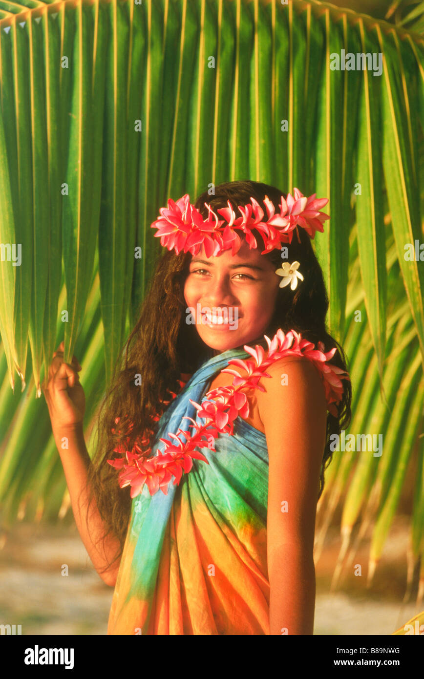 Polynesian girl with flower lei on Cook Islands in sunset light Stock ...