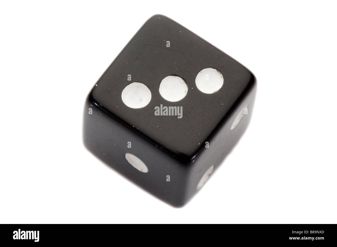 Black dice with number three a over white background Stock Photo - Alamy