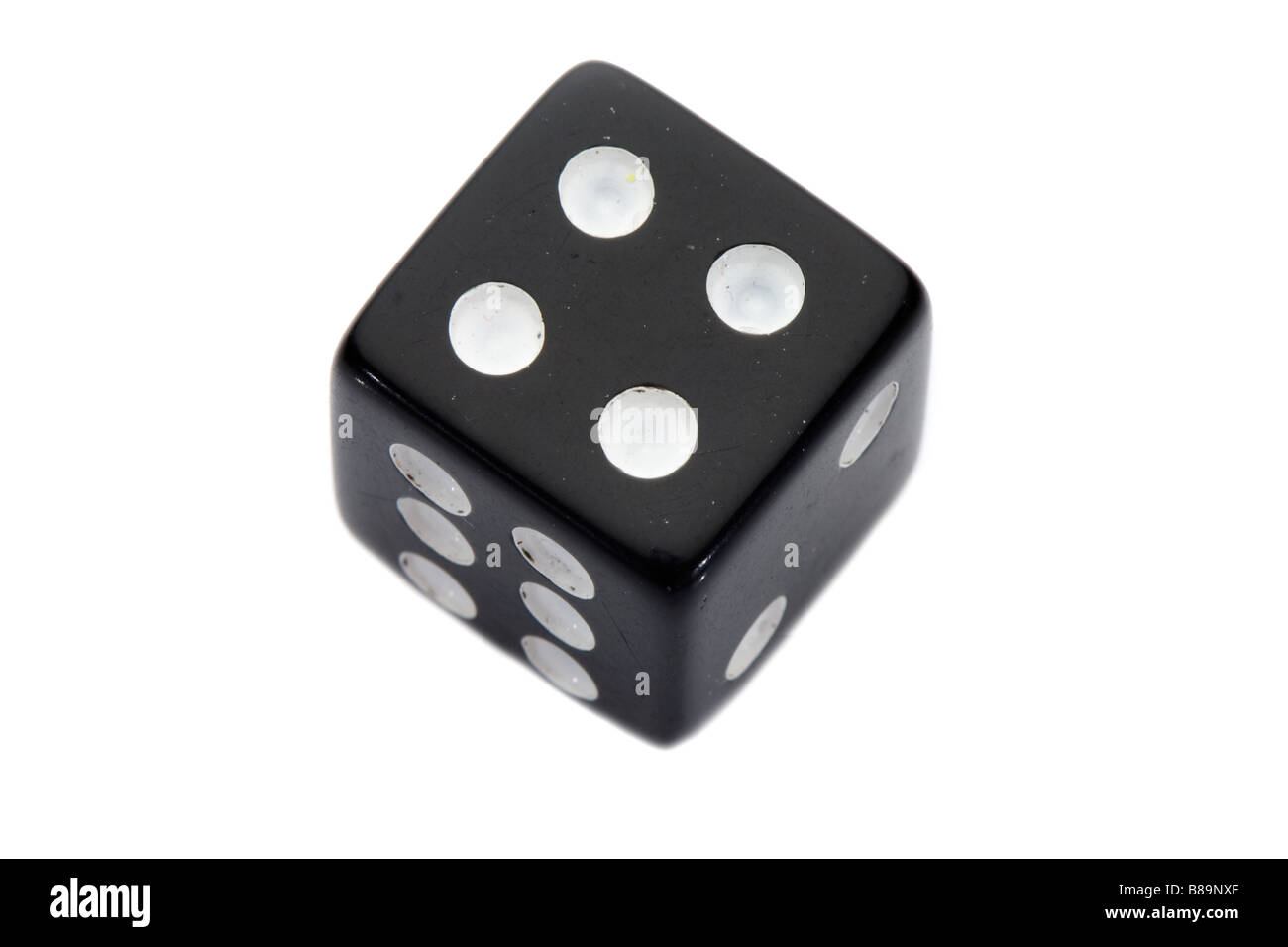 Black dice with number four a over white background Stock Photo - Alamy