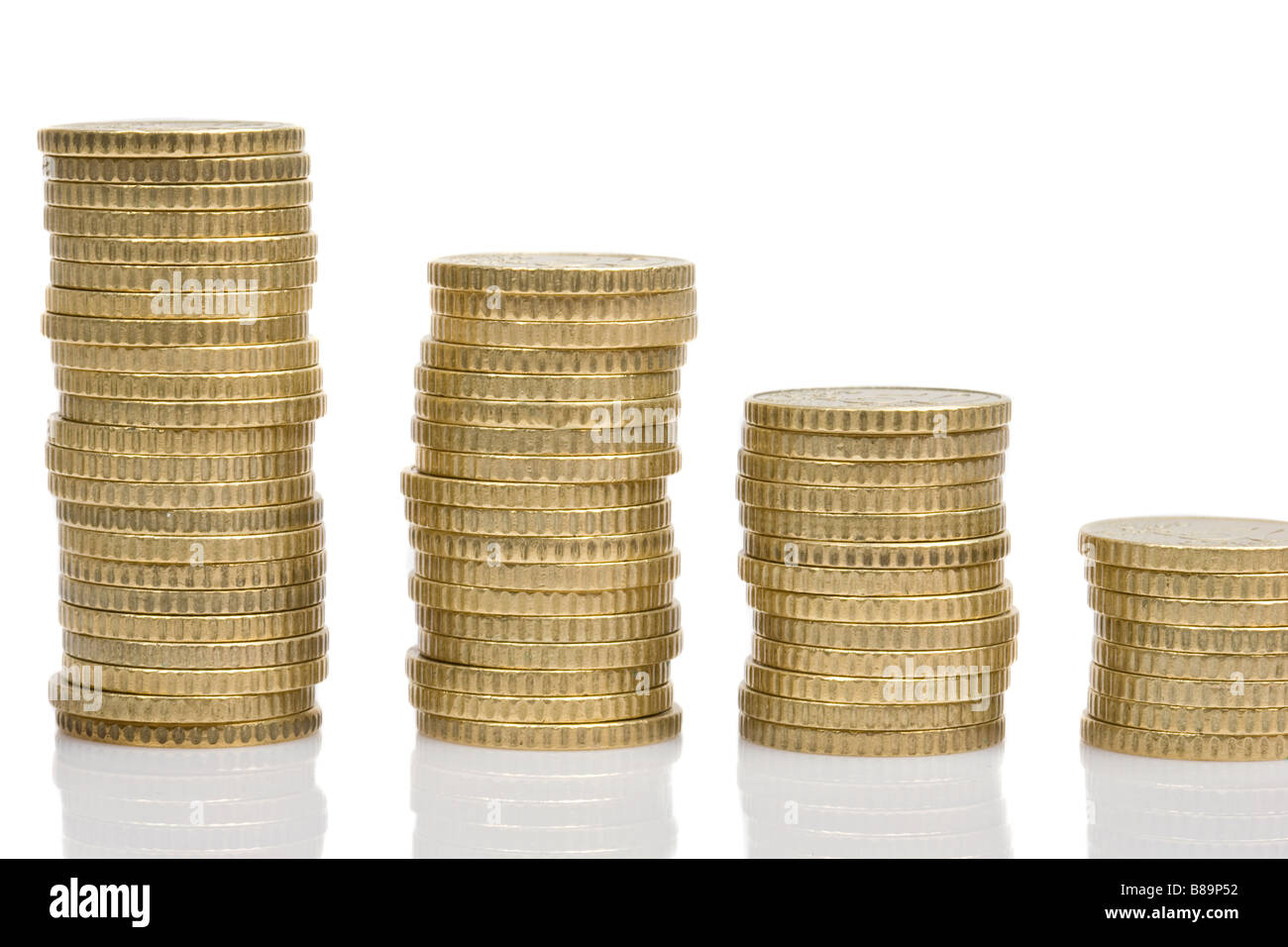 Four piles of money isolated on white Stock Photo - Alamy