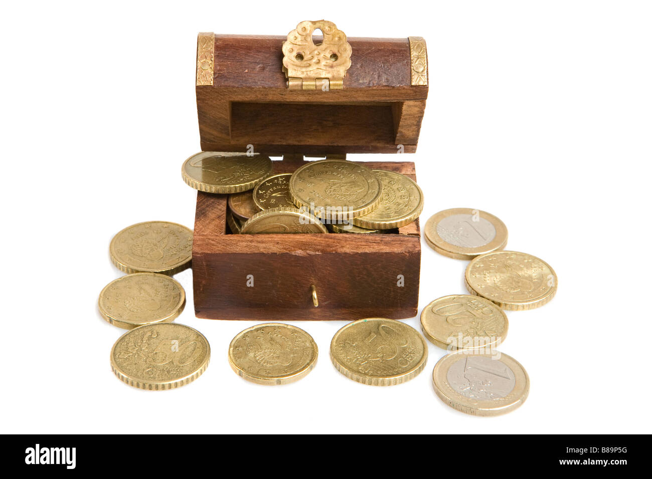 Coffer wooden open with many currencies on a over white background ...