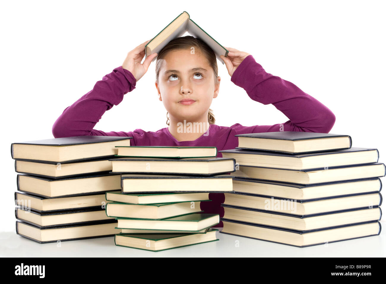 Adorable girl with many books on a over white background Stock Photo ...