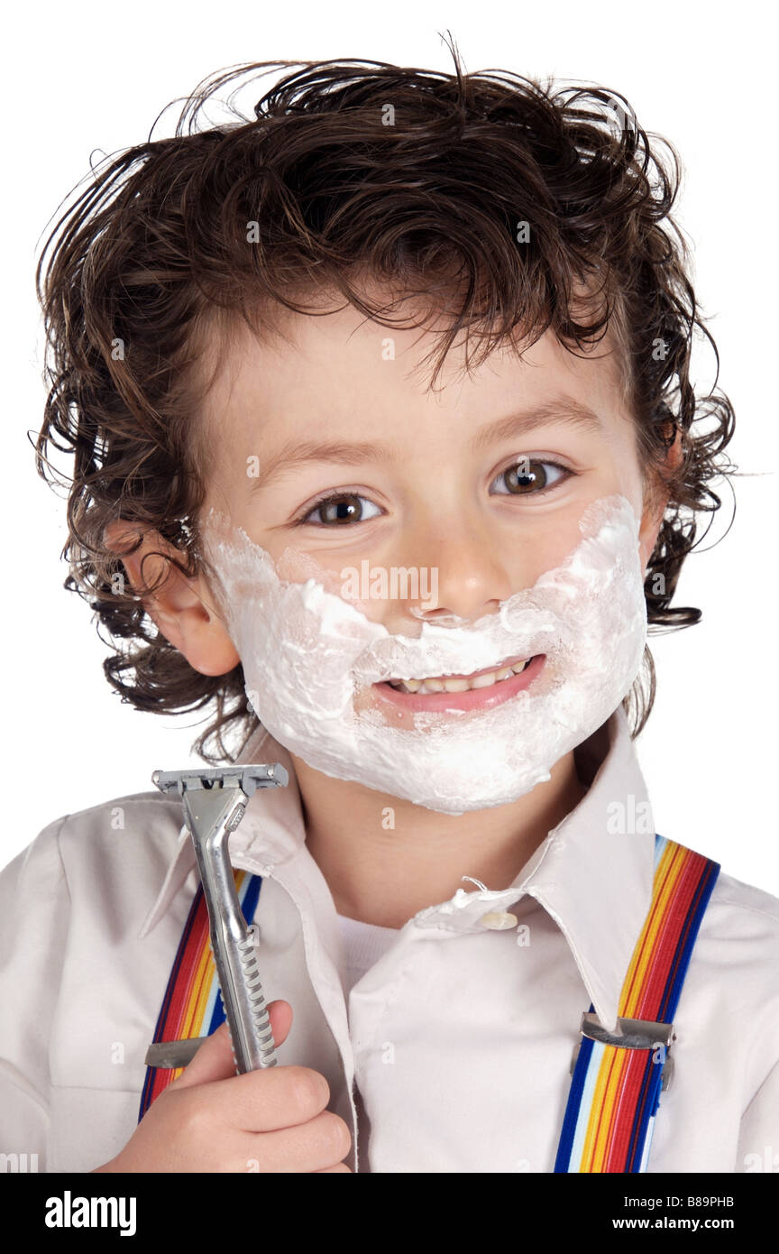 Adorable child shaving over a white background Stock Photo - Alamy