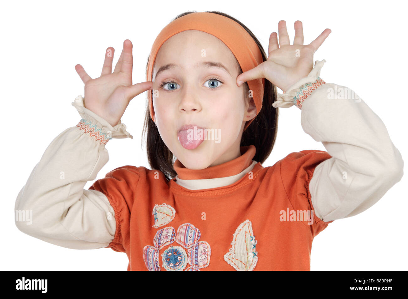 Mocking adorable girl a over white background Stock Photo - Alamy