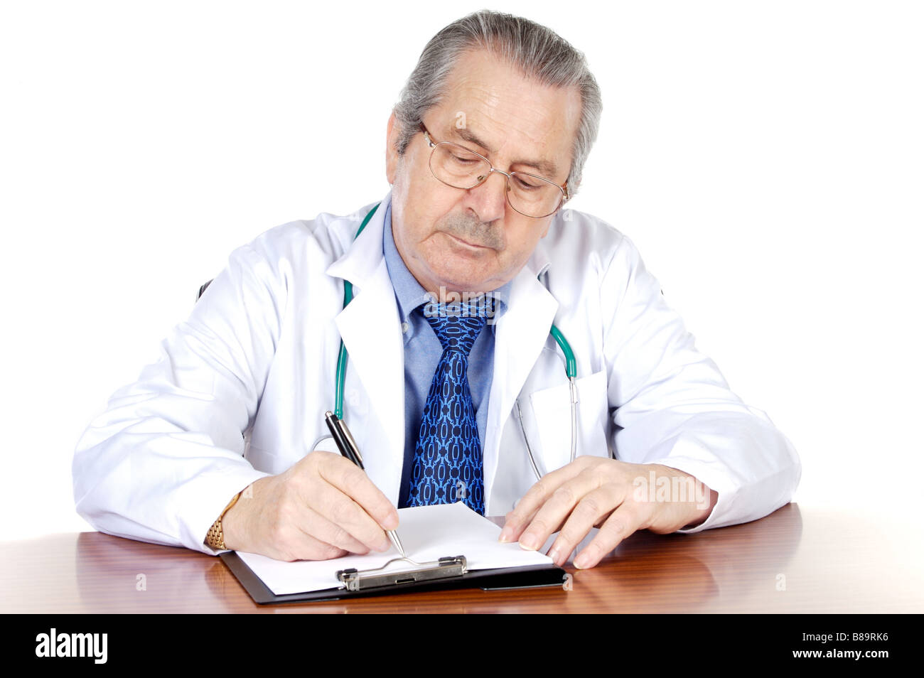 seniors doctor writing a over white background Stock Photo - Alamy