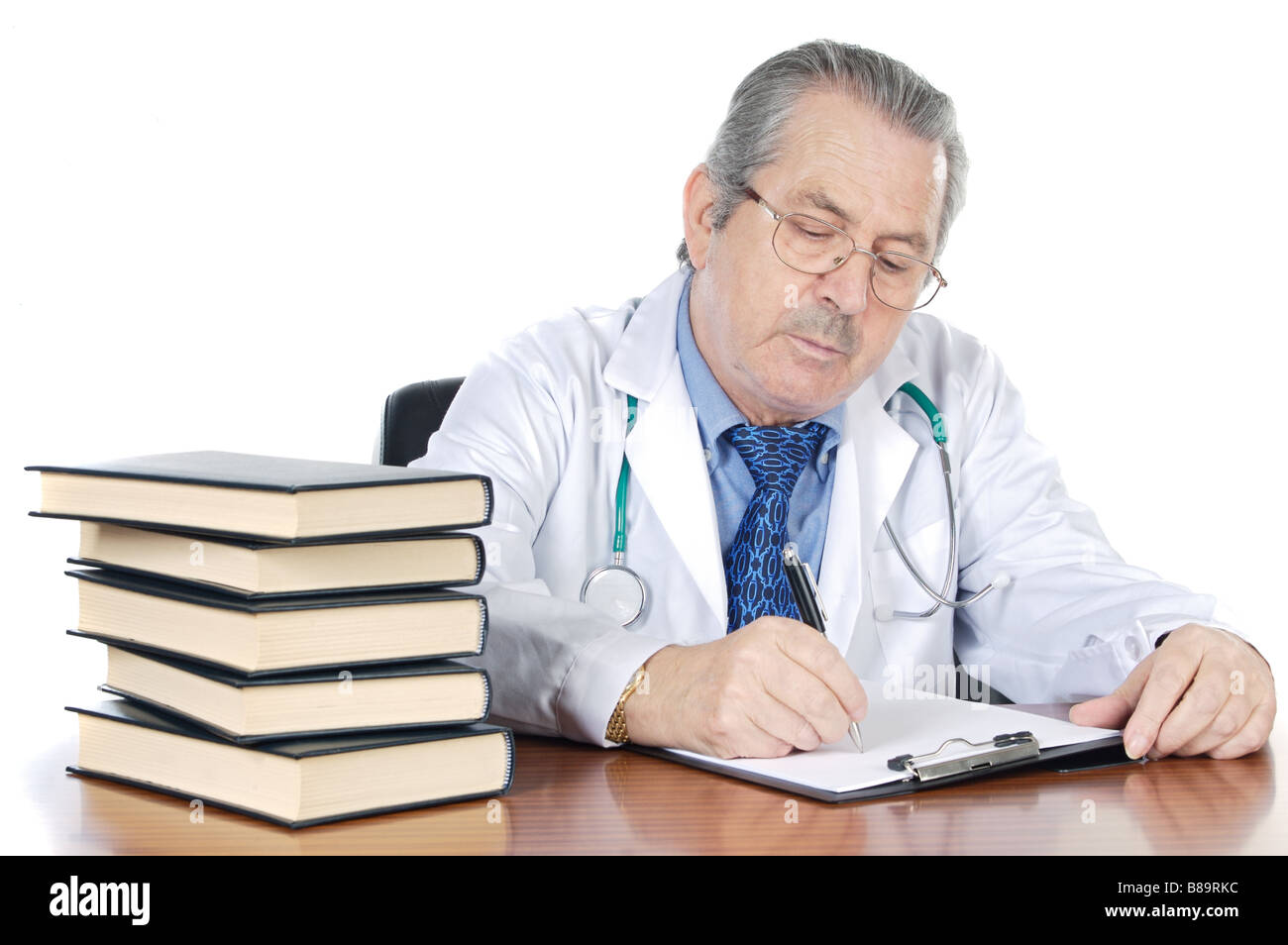 seniors doctor writing a over white background Stock Photo - Alamy