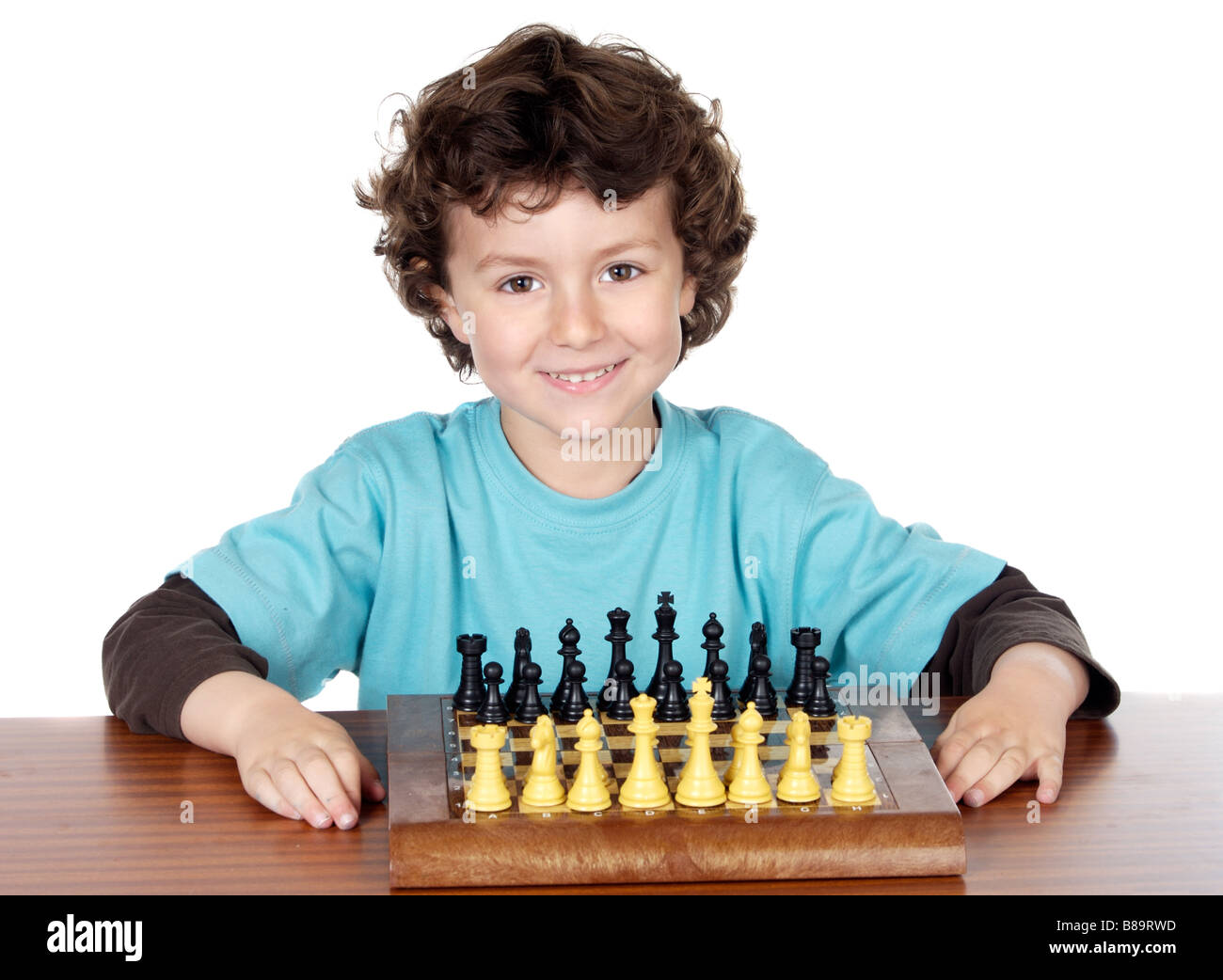 adorable boy playing the chess a over white background Stock Photo - Alamy