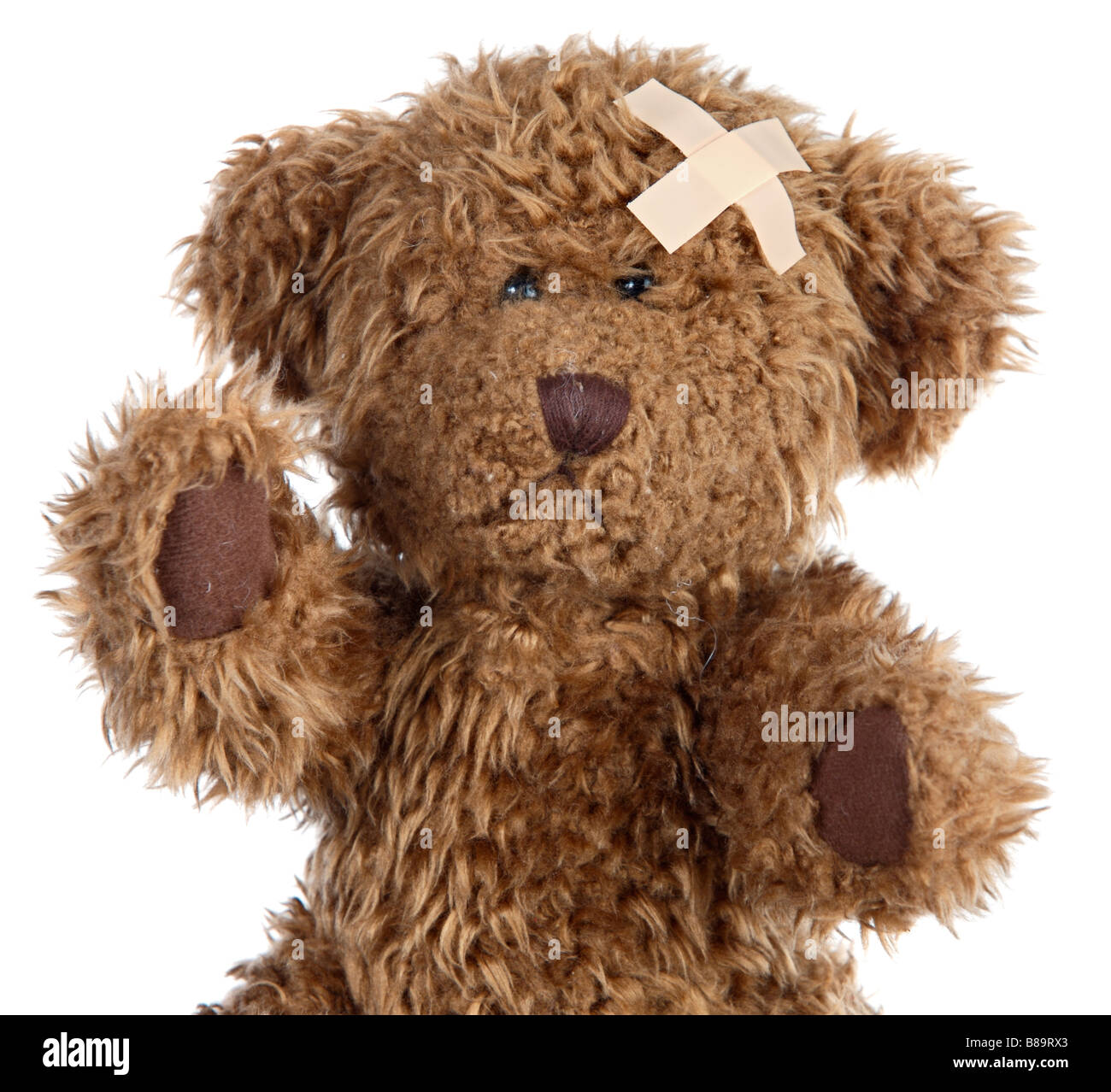 Teddy bear with plaster over white background Stock Photo - Alamy