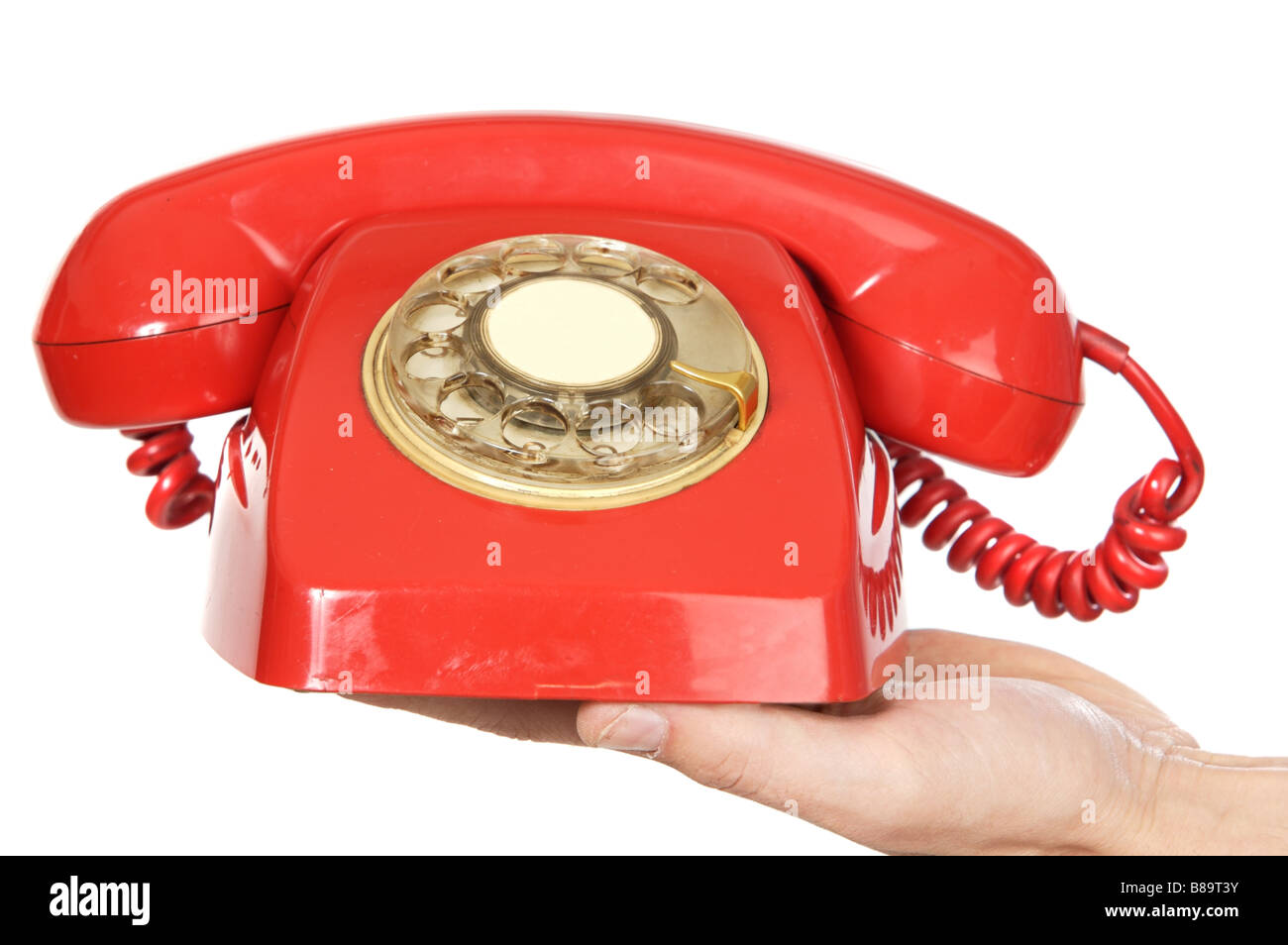 hand holding red telephone a over white background Stock Photo - Alamy