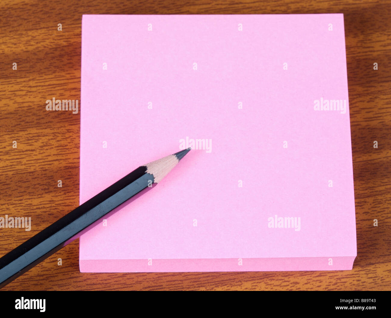a photo of a Post It and pencil on the table Stock Photo - Alamy