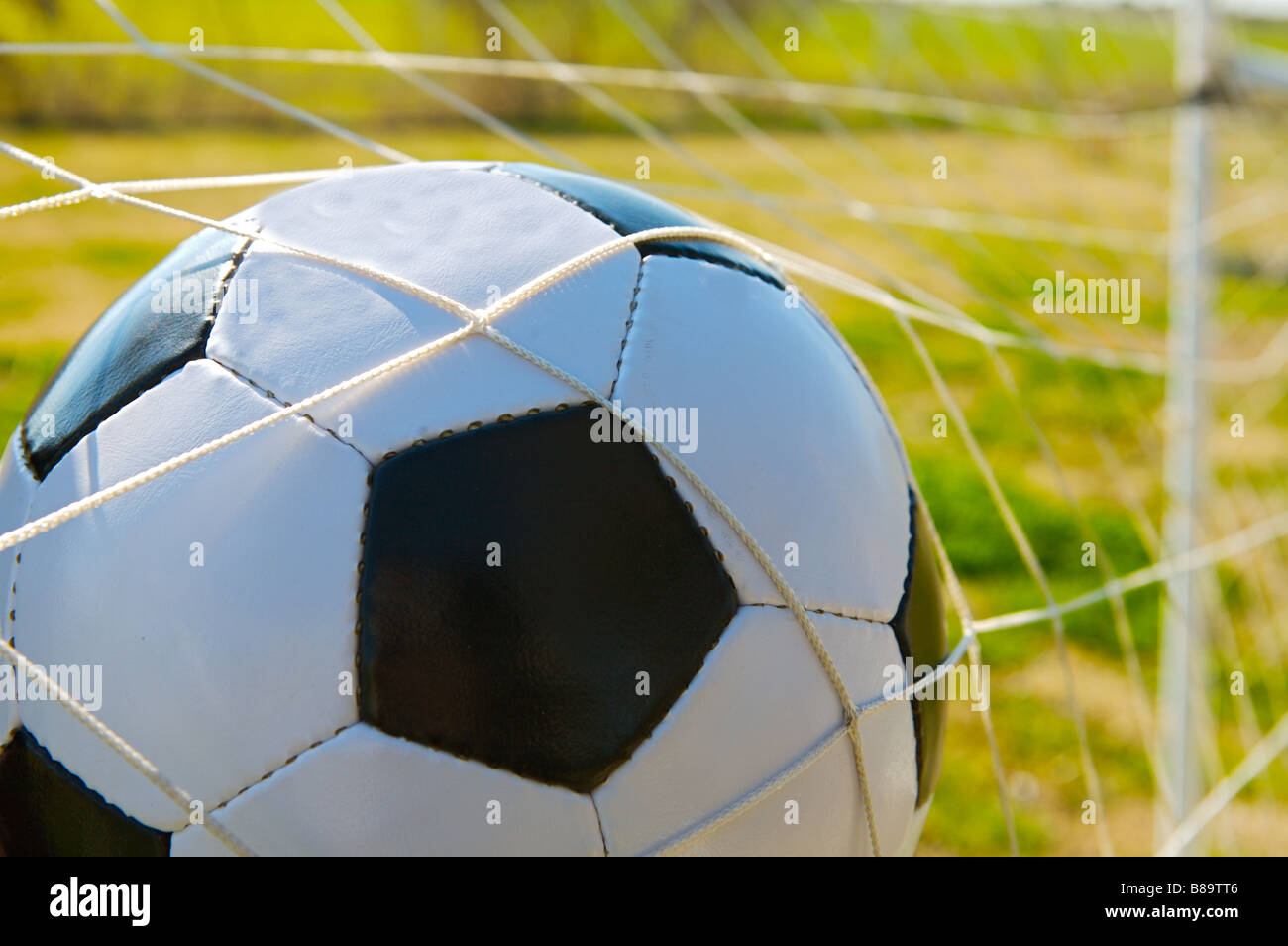 Photo of a ball inside the goal Stock Photo - Alamy