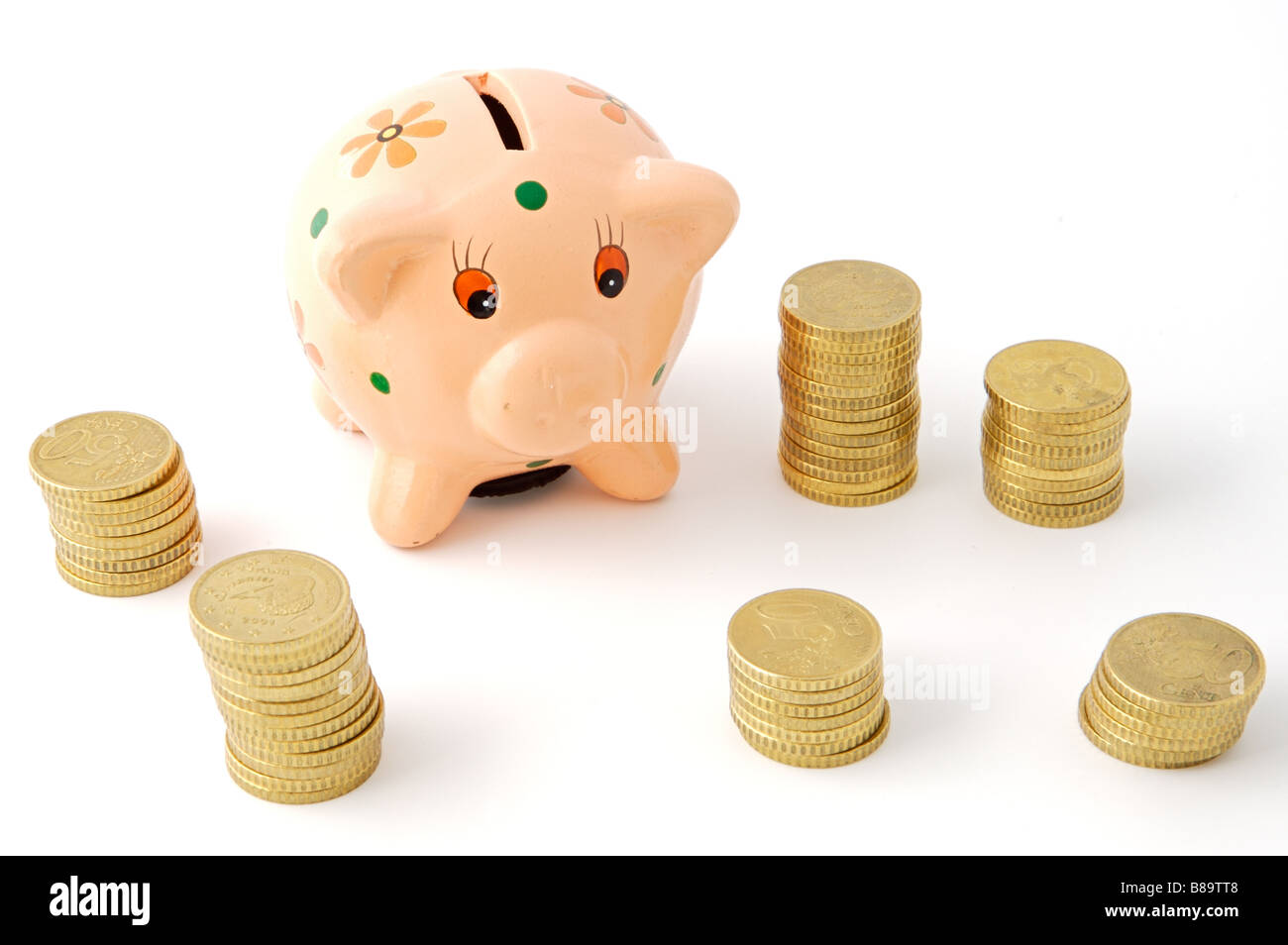 currencies in a money box over white background Stock Photo - Alamy