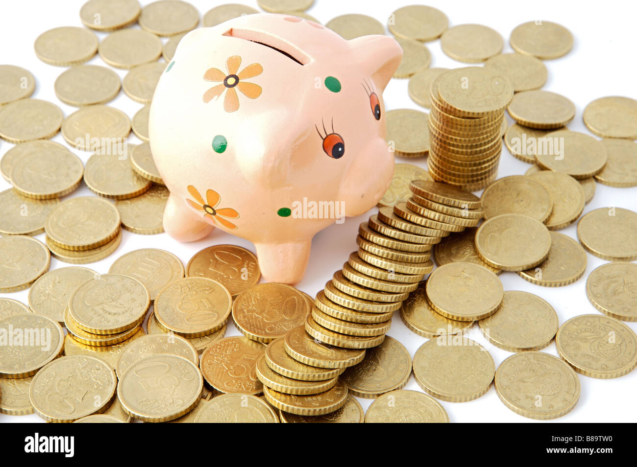 currencies in a money box over white background Stock Photo - Alamy