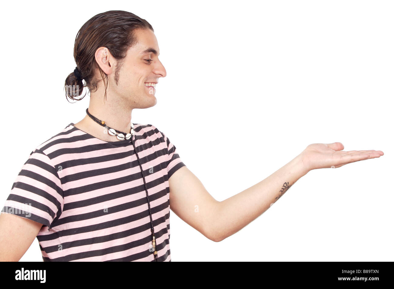 Young man holding nothing over a white background Stock Photo - Alamy